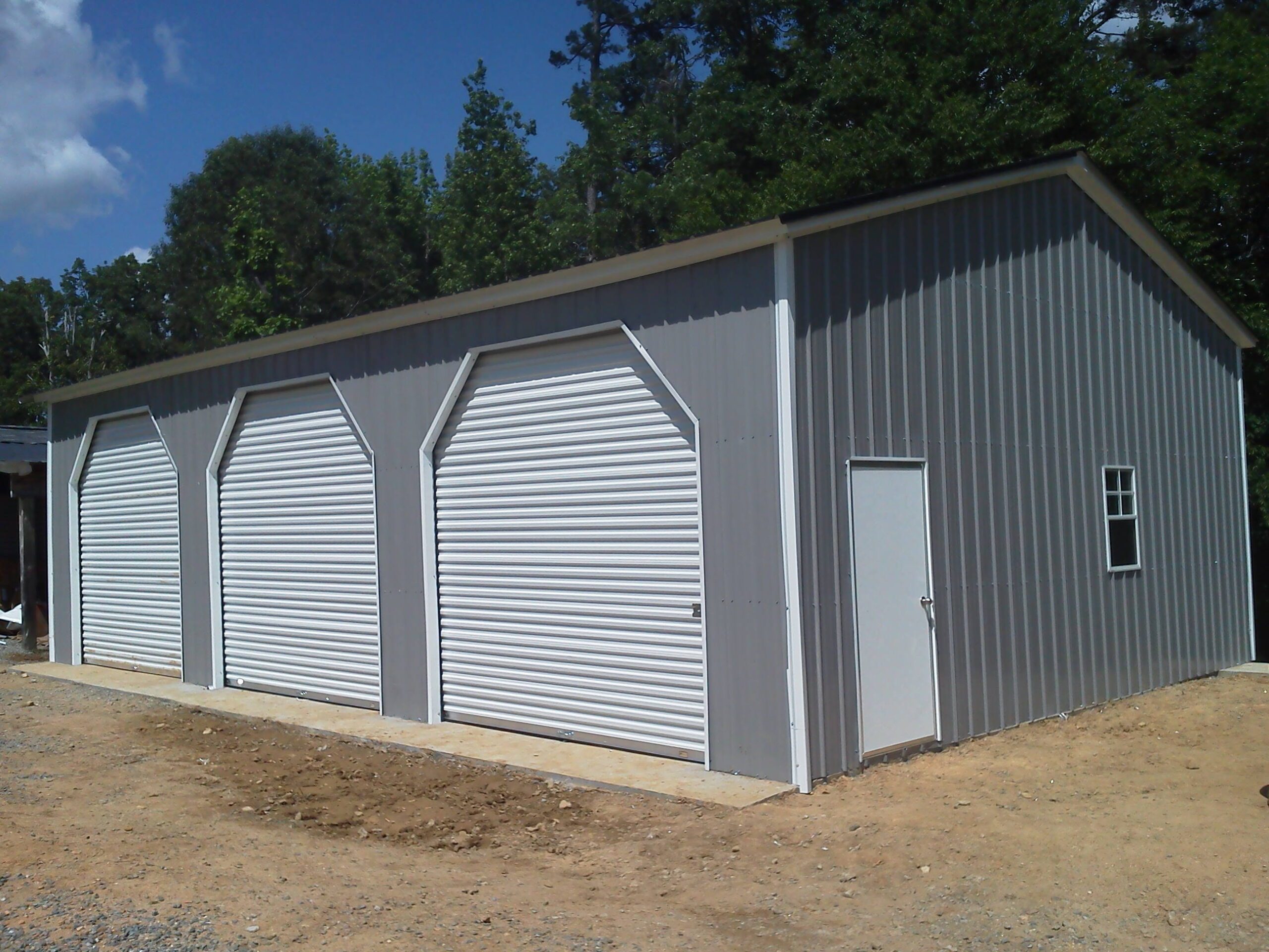 A Frame Fully Verticle Sidewinder Garage with 3 rollup doors with dutch ...
